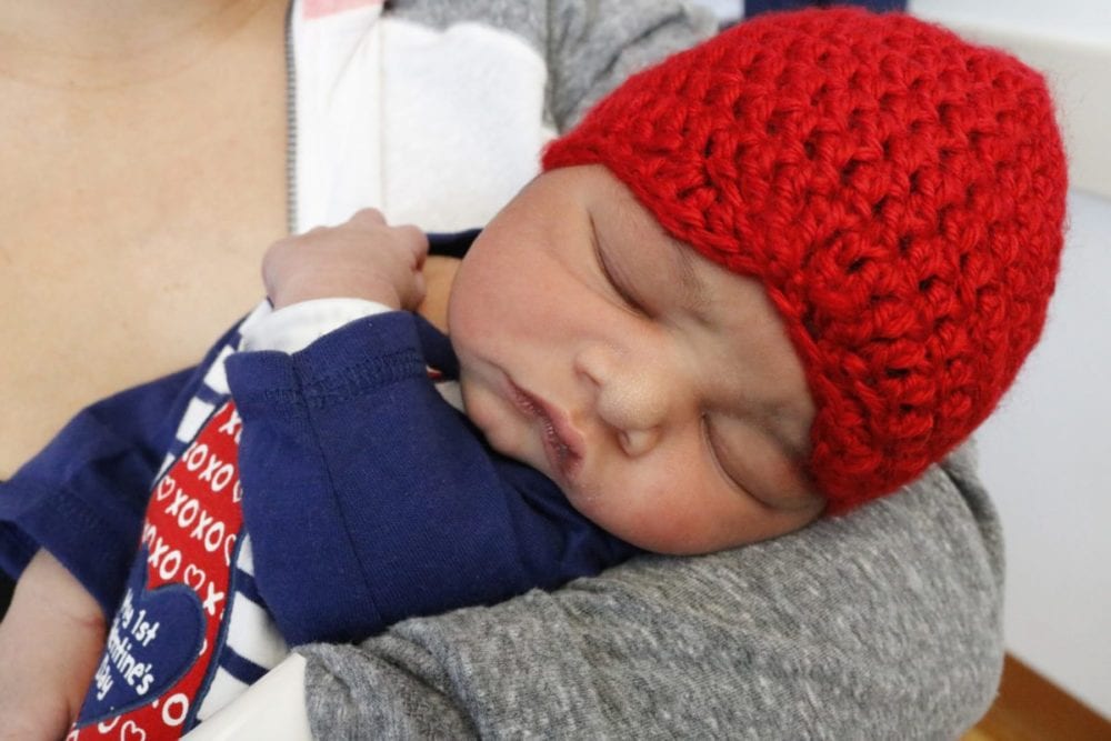 Newborns at Henry Mayo receiving red hats for Heart Month