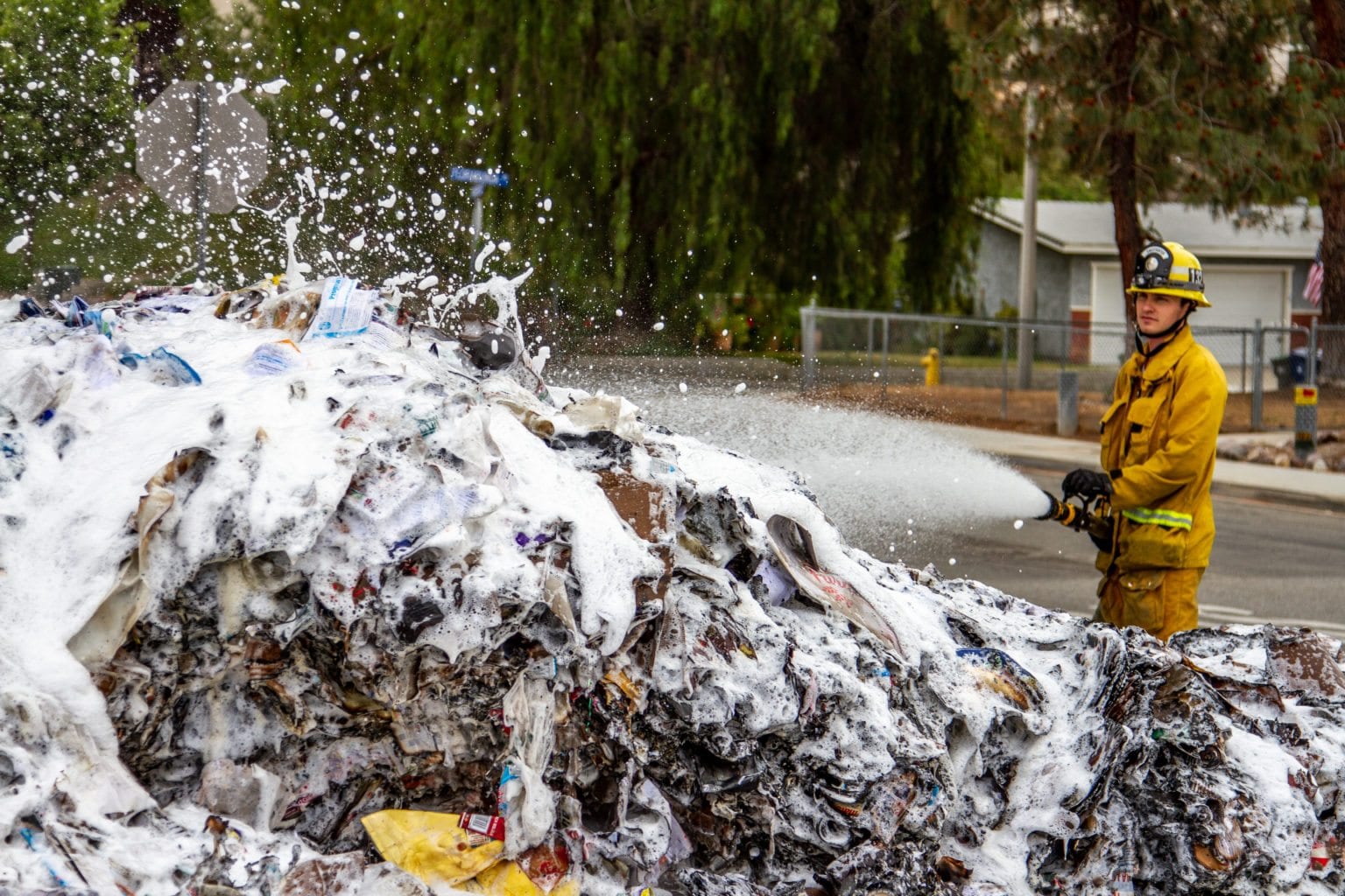 UPDATE: Burning garbage in trash truck dumped on street