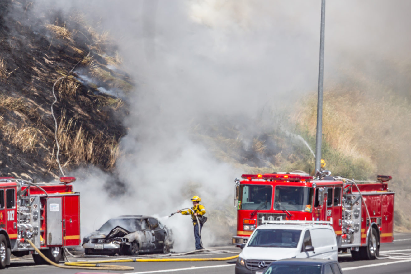 Firefighters handle brush fire on side of Highway 14