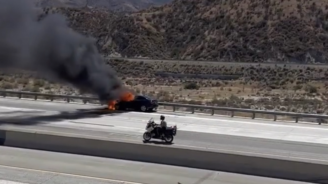Firefighters extinguish vehicle fire on Highway 14