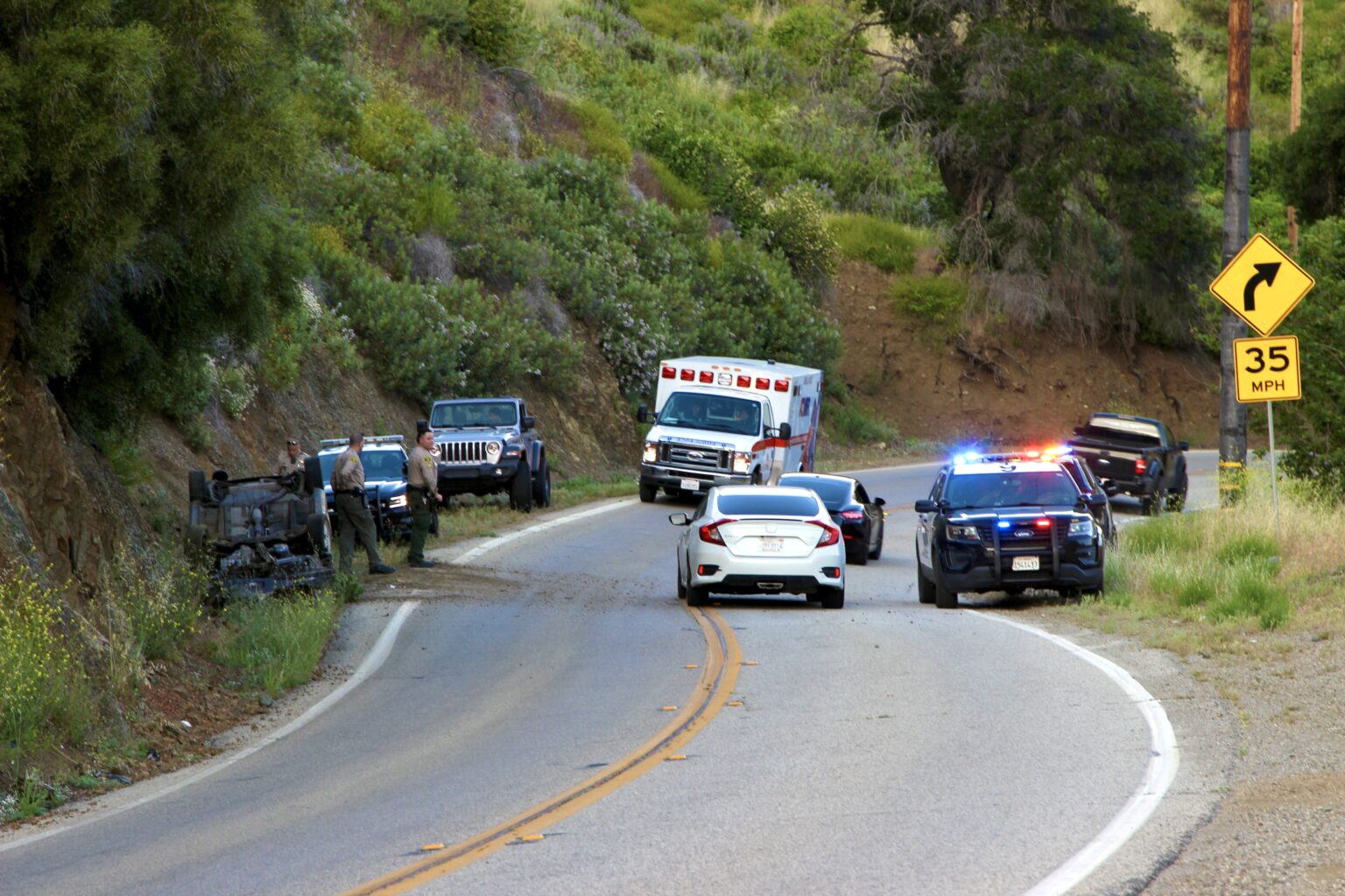 Single vehicle crashes into mountain and rolls over