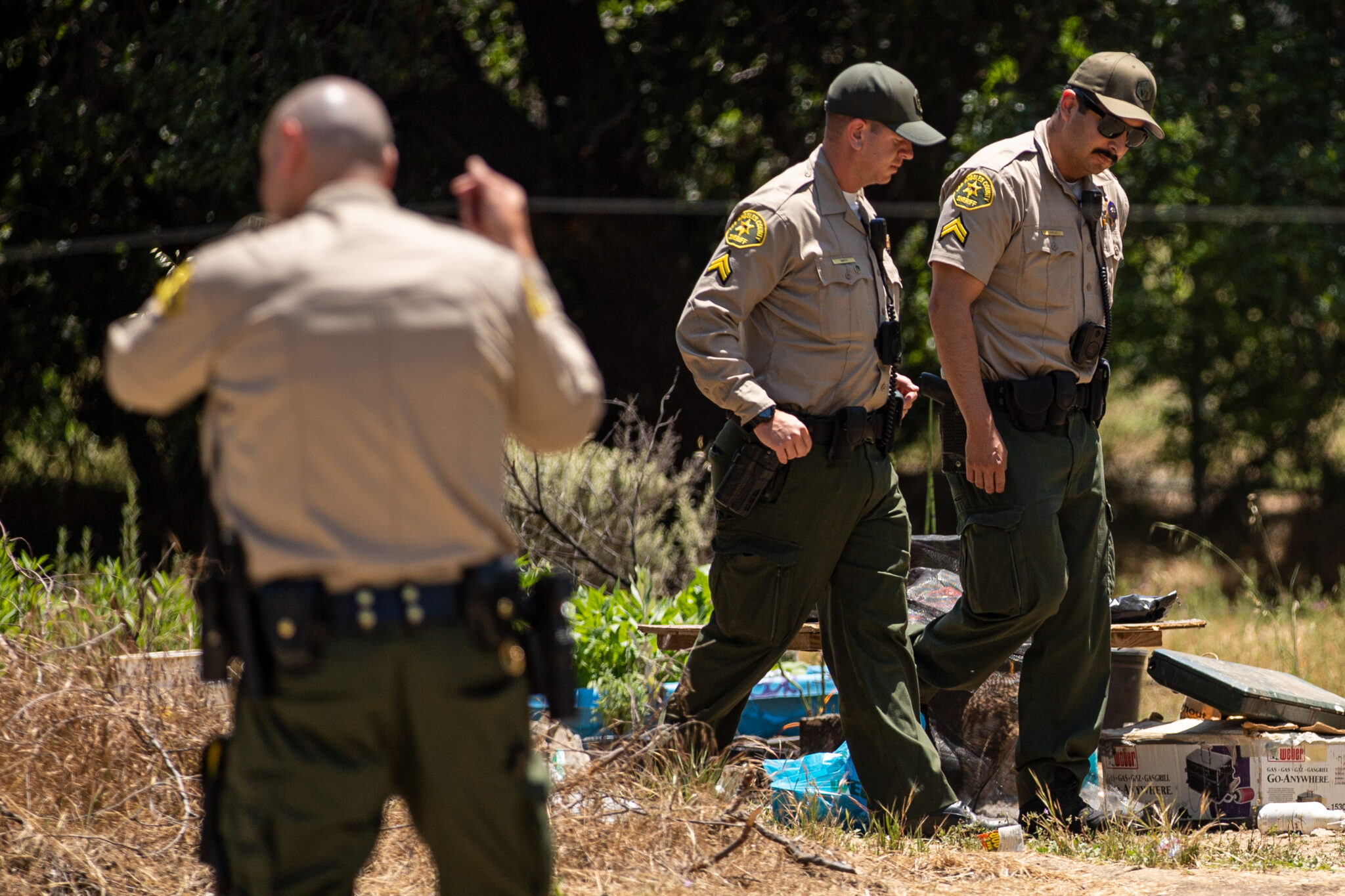 Man detained after reportedly pointing shotgun at passerby